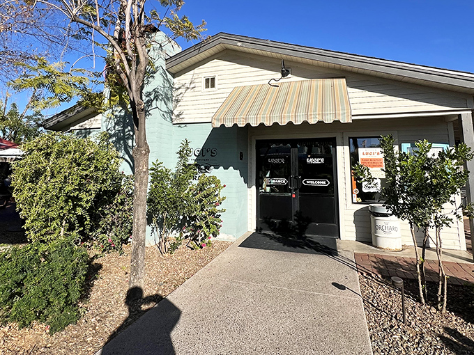 The mint-green exterior with its jaunty striped awning practically whispers, "Come in, the pancakes are calling." A charming first impression that promises good things inside.