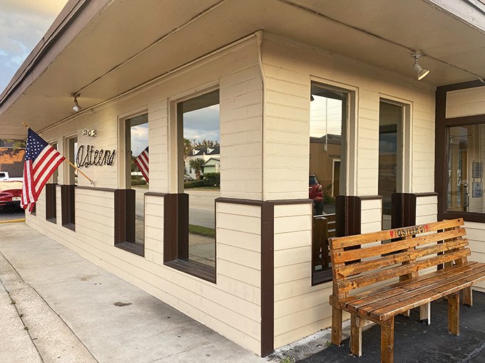 The unassuming exterior of O'Steen's, where that wooden bench isn't just seating&mdash;it's the waiting room for some of Florida's finest seafood.