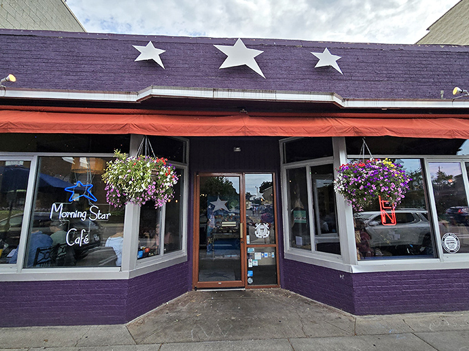 The purple facade with its cheerful red awning and hanging flower baskets isn't just eye-catching&mdash;it's nature's way of saying "breakfast is served!"