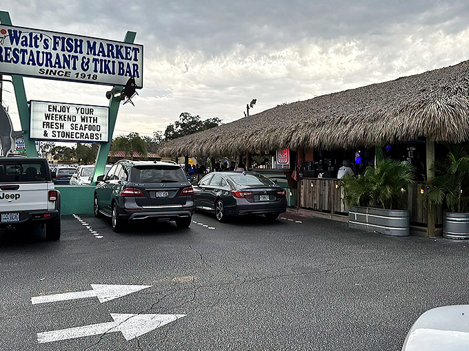 The thatched tiki roof of Walt's Fish Market beckons like a tropical mirage, promising seafood so fresh it practically introduces itself.