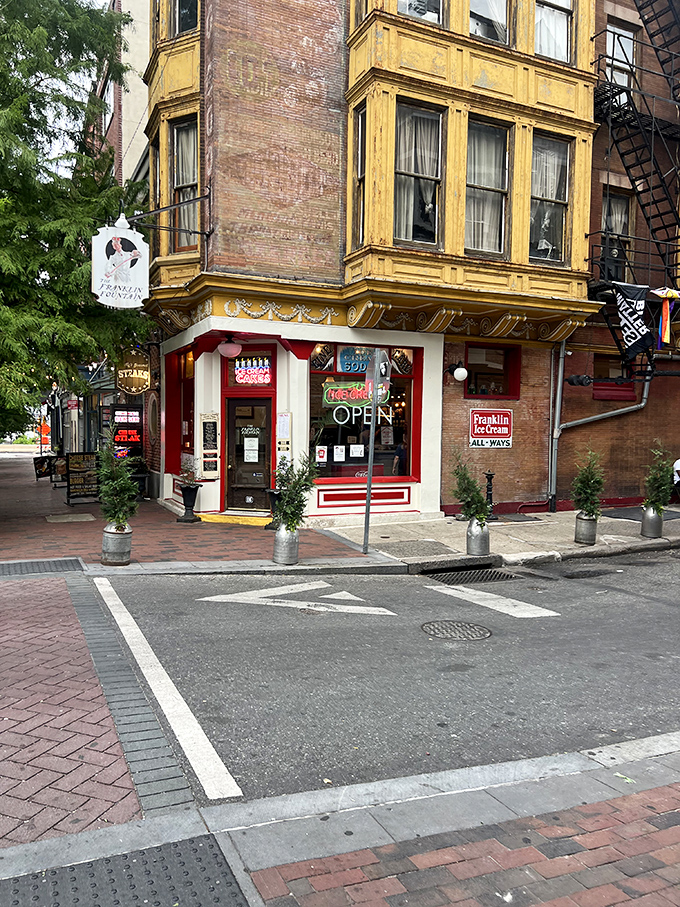 The corner of Market and Letitia Streets houses a time machine disguised as an ice cream shop. That glowing neon "OPEN" sign is Philadelphia's version of the pearly gates.