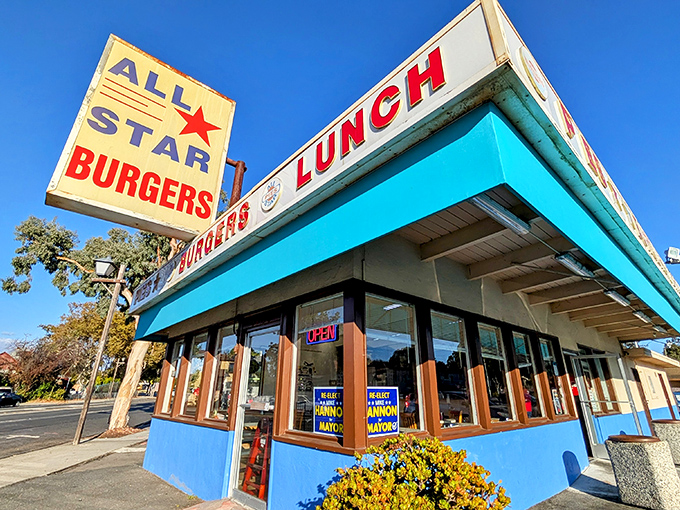That turquoise trim isn't just eye-catching&mdash;it's a beacon of burger hope on the Newark horizon. The vintage sign promises simple pleasures done right.