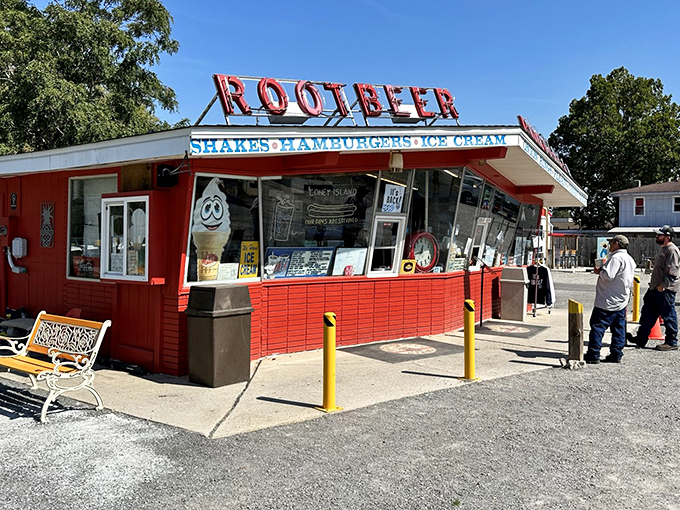 The iconic red exterior of The Root Beer Stand glows like a beacon of nostalgia, promising frosty mugs and comfort food that transcends time.The iconic red exterior of The Root Beer Stand glows like a beacon of nostalgia, promising frosty mugs and comfort food that transcends time.