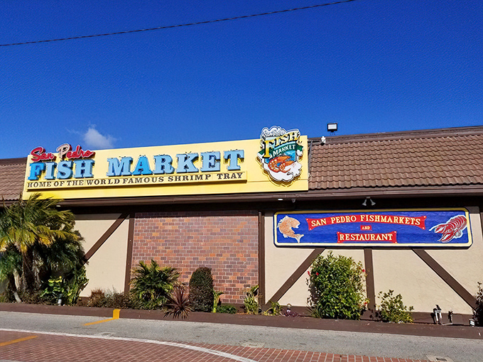 The iconic blue sign beckons seafood lovers like a lighthouse guiding hungry sailors home. This unassuming exterior hides a world of oceanic delights within.