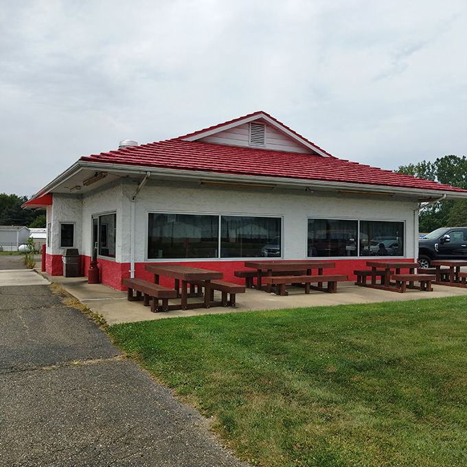 The iconic red-roofed building stands like a BBQ beacon, promising smoky delights to hungry travelers passing through Nashport.