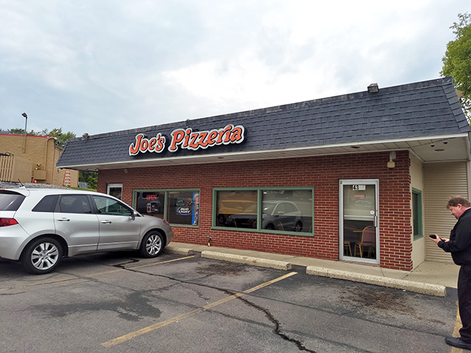 The brick facade of Joe's Pizzeria stands like a time capsule under Ohio skies, promising pizza perfection that's remained unchanged while the world around it spins madly on. 