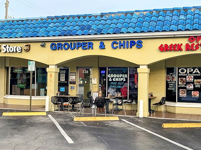 The unassuming exterior of Grouper & Chips, with its bright blue roof and yellow walls, proves once again that culinary treasures often hide in plain sight.
