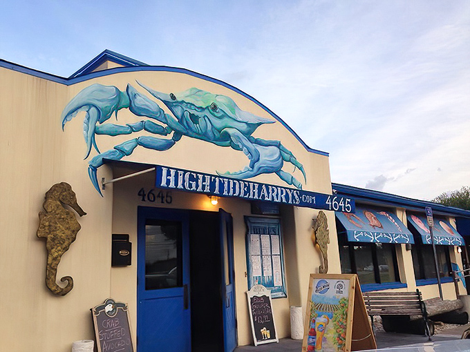 A seafood siren song in blue and white, High Tide Harry's exterior promises oceanic delights with its giant crab sculpture and splashy nautical theme.