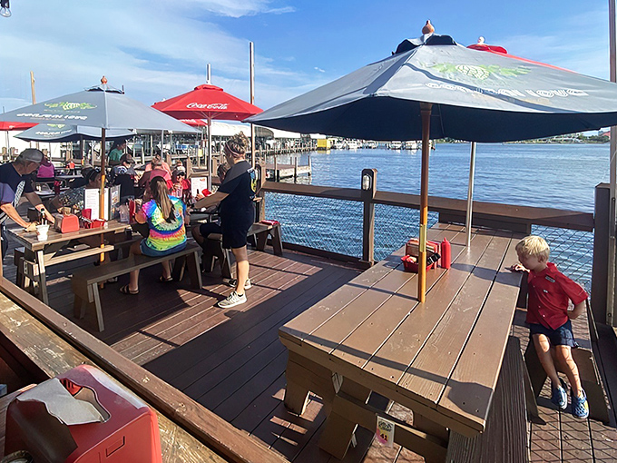 The unassuming yellow exterior of The Shack stands like a beacon of culinary promise on Fort Walton Beach's coastline. No pretense, just seafood perfection awaiting inside.