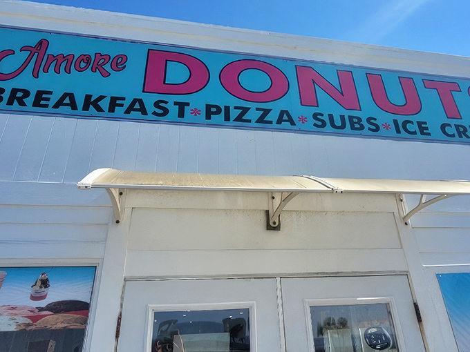 The unassuming white exterior of A'More Donuts hides culinary treasures within, like finding a Picasso at a yard sale.