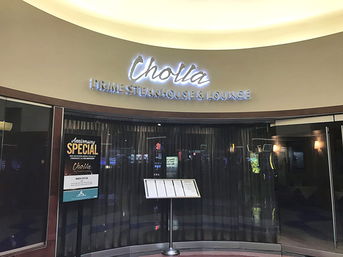 The sleek entrance to Cholla beckons like a culinary oasis in the desert, promising treasures that go far beyond its understated exterior.