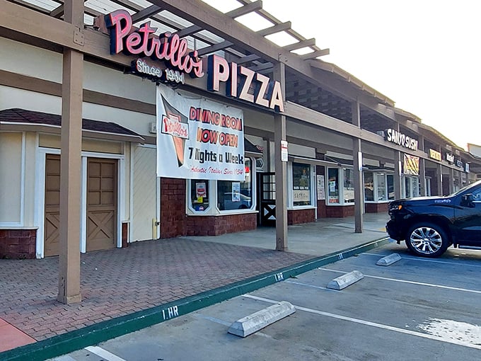 The iconic red sign beckons like a lighthouse for the pizza-obsessed. Since 1954, this Glendora institution has been proving that sometimes the best things don't change.