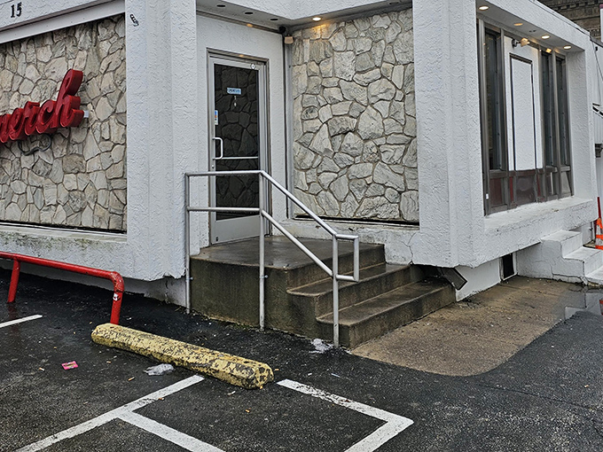 The iconic stone facade of Llanerch Diner stands like a culinary lighthouse, beckoning hungry travelers with its classic red signage and timeless charm.