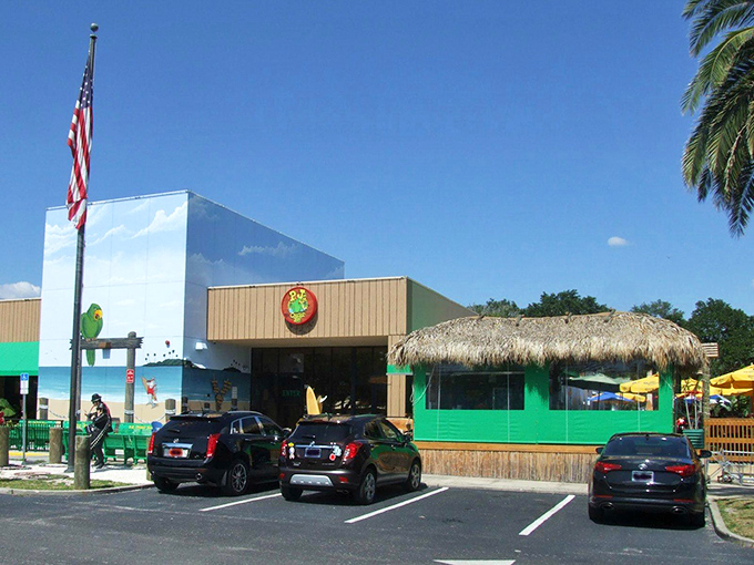 The thatched tiki roof and vibrant green exterior of P.J.'s stands out like a tropical oasis, promising seafood treasures within this Indian Rocks Beach landmark.
