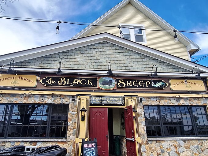 The stone facade and iconic red doors of The Black Sheep stand like a culinary lighthouse on Niantic's shore, beckoning hungry travelers with promises of exceptional fare.