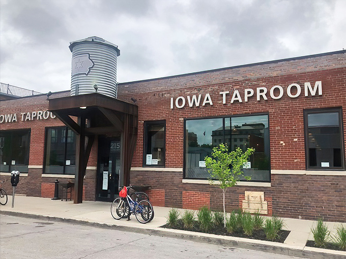 The iconic silo-shaped water tower proudly announces your arrival at The Iowa Taproom, where brick, bikes, and brews create the perfect Des Moines welcome.