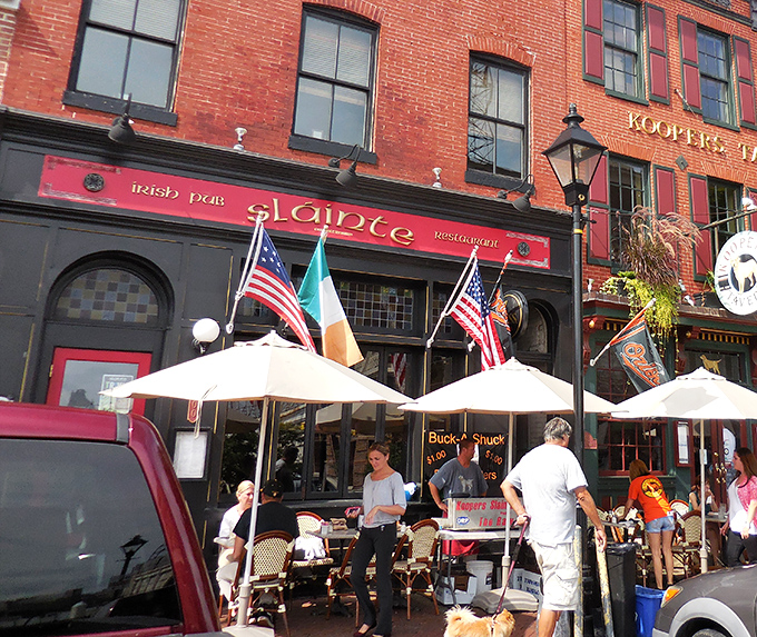 The crimson fa&ccedil;ade of Slainte stands proudly on Thames Street, Irish flag waving between American ones&mdash;a diplomatic sandwich of international goodwill.