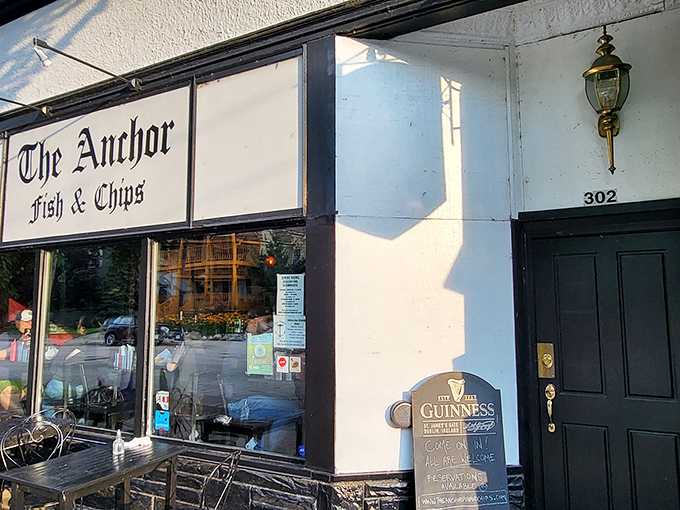 The classic black and white signage of The Anchor Fish & Chips stands as a beacon of British comfort food in Northeast Minneapolis.
