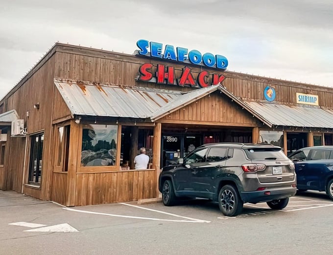 The wooden exterior of Walkertown Seafood Shack stands like a beacon of fried goodness, promising seafood treasures within those rustic walls.