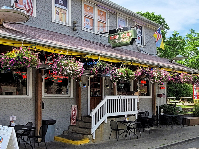 The Turf Club's exterior blooms with hanging flower baskets, a colorful welcome that says, "Yes, we care about beauty, but we care about burgers more."