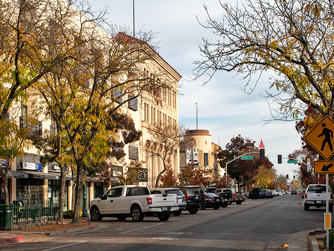 The historic El Capitan Hotel stands tall against California's endless blue sky, a testament to Merced's blend of affordability and architectural charm.