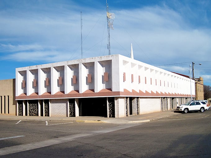 The historic Lyceum Theater stands as a sentinel of Clovis's past, its vintage neon sign glowing against the evening sky like a beacon from another era.