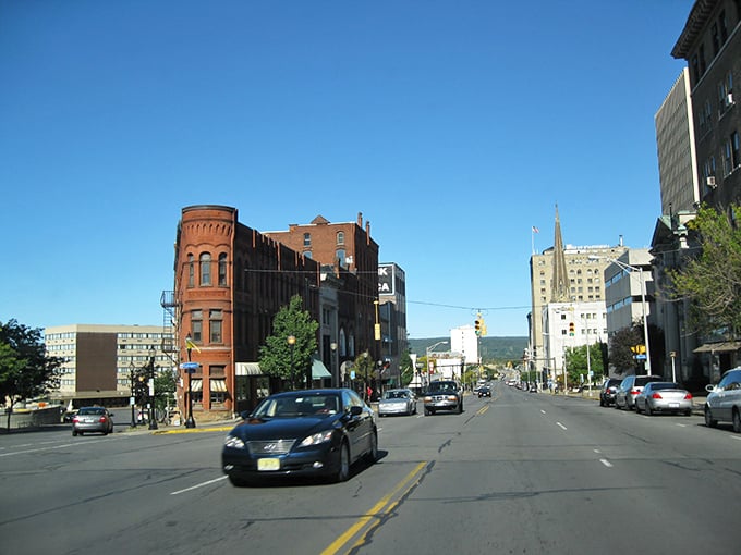 Downtown dreams under blue skies! Utica's flatiron building stands proud like a brick sentinel guarding the city's beating heart.