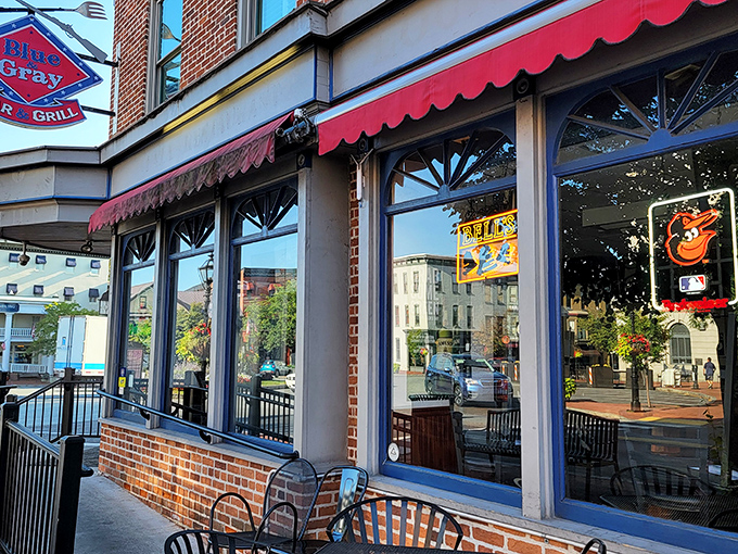 The red awnings of Blue & Gray Bar & Grill beckon like culinary semaphore signals amidst historic Gettysburg's brick backdrop. A sight for hungry eyes.