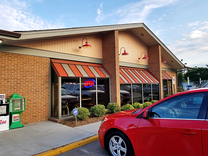The orange and white striped awnings of Rock Hill Diner beckon like a breakfast lighthouse guiding hungry souls to their morning salvation.