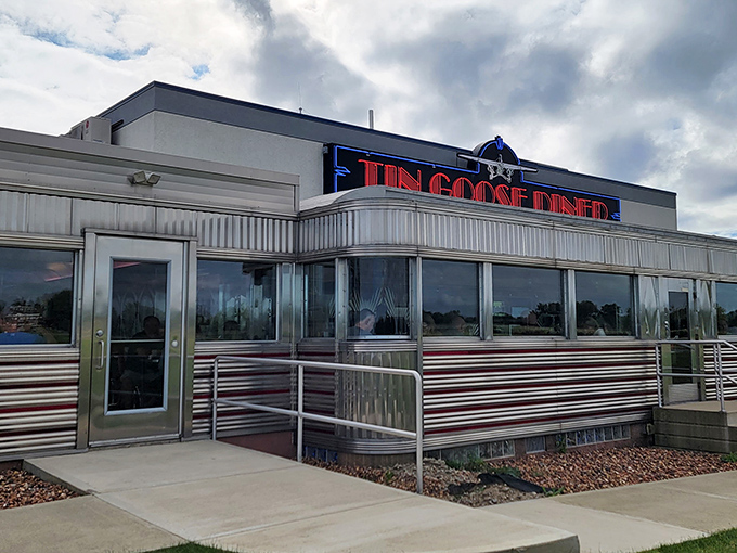 The gleaming stainless steel exterior of Tin Goose Diner shines like a beacon of hope for hungry travelers. This isn't just a restaurant&mdash;it's a time machine with pancakes.
