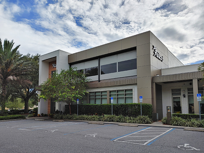 Modern elegance meets Florida charm at Del Frisco's exterior, where palm trees stand guard over what might be the best steak-eating decision of your life.