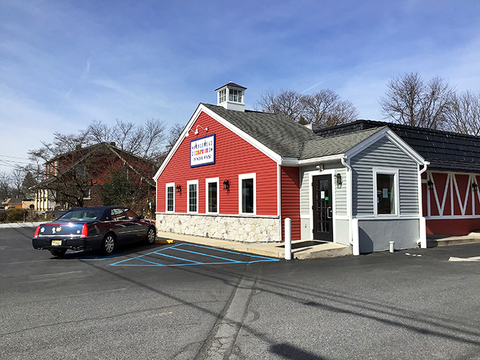 The iconic red barn exterior of Marblehead Chowder House stands like a lighthouse for seafood lovers, beckoning hungry travelers with promises of coastal delights.
