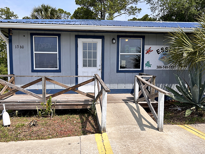 The blue-roofed beacon of seafood salvation sits unassumingly in Pierson, promising "Famous Fried Clams" that have seafood pilgrims filling the parking lot daily.