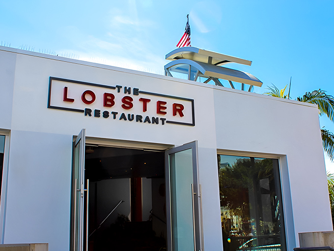 The pristine white exterior of The Lobster beckons seafood lovers at the entrance to Santa Monica Pier, promising oceanic delights with unbeatable views.