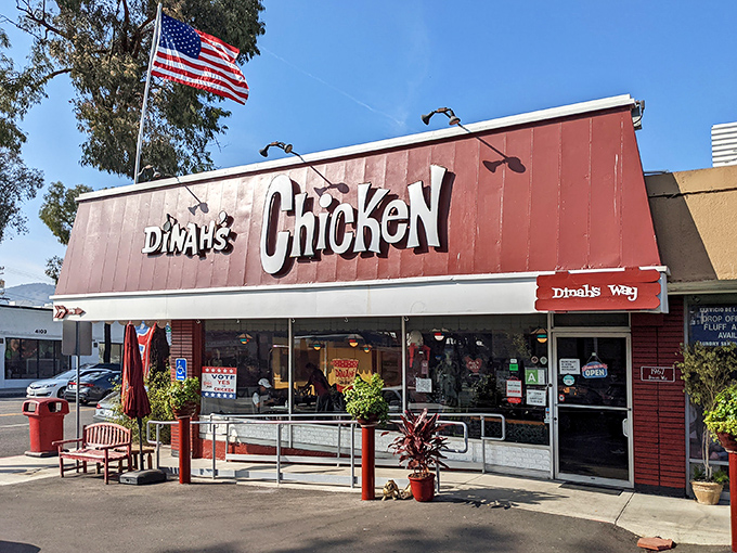 The bright red exterior of Dinah's Chicken stands like a beacon of comfort food salvation in Glendale, promising fried poultry paradise within.