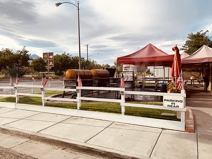 The iconic red barn-like exterior of Copper Top BBQ, where those massive smokers out front aren't just for show&mdash;they're the source of that heavenly aroma that hits you from a quarter-mile away.