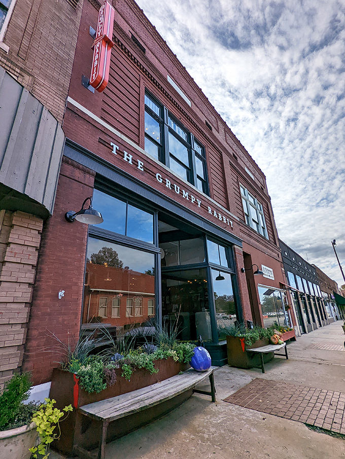 The historic brick facade of The Grumpy Rabbit stands proudly on Lonoke's main street, promising culinary adventures behind those welcoming windows.