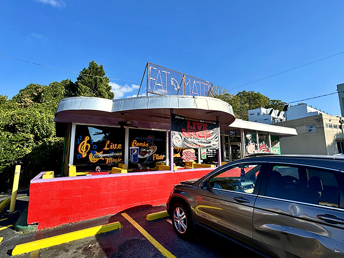 The neon "FAT MATT'S" sign glows like a barbecue beacon against the twilight sky, promising smoky salvation to hungry Atlanta souls.
