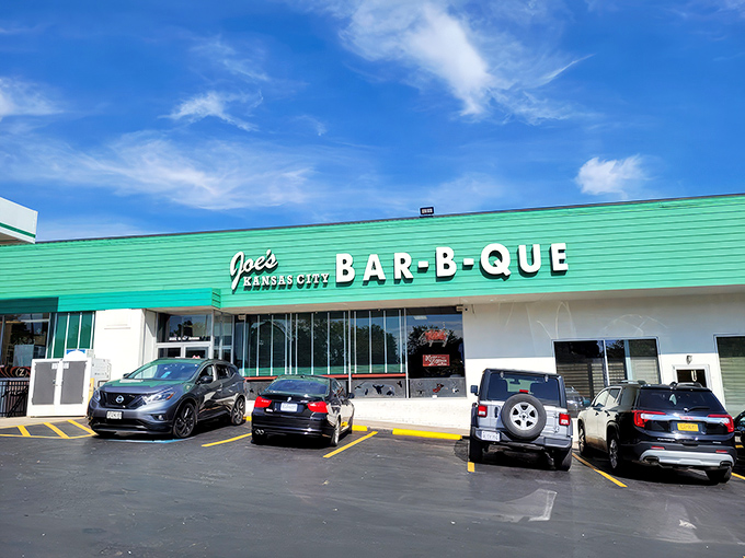 The iconic green exterior of Joe's KC BBQ beckons like a barbecue lighthouse, promising smoky treasures within this former gas station turned culinary landmark.