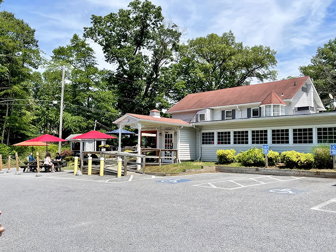 The unassuming exterior of The Hideaway belies the culinary treasures within. Those colorful umbrellas are like beacons calling hungry travelers home.