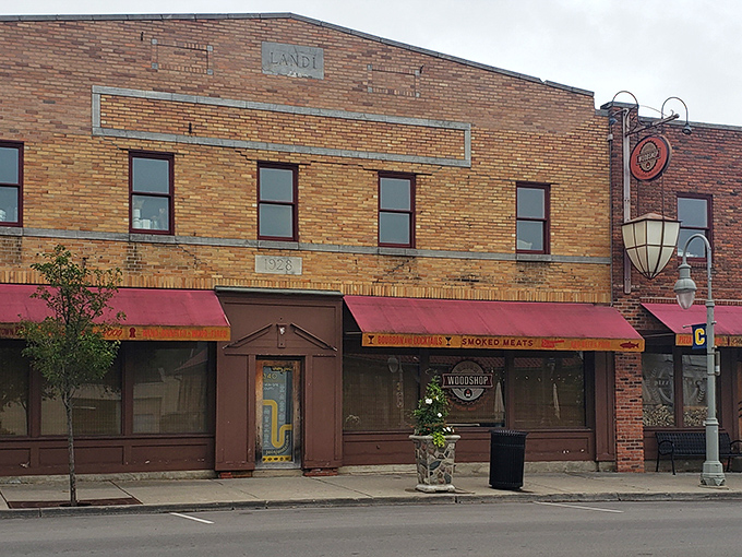 The line forms early outside Union Woodshop, where the yellow "BOURBON AND COCKTAILS" and "SMOKED MEATS" signs promise delicious things to those patient enough to wait.