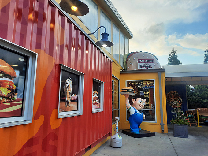 Welcome to burger paradise! Hi-Pointe Drive-In's whimsical exterior, complete with a giant burger sculpture, promises the kind of meal that makes grown adults giggle with anticipation.