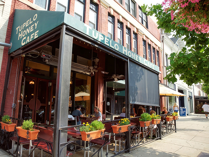The golden-lettered storefront beckons like a Southern siren song, promising comfort food salvation on a busy Asheville street.