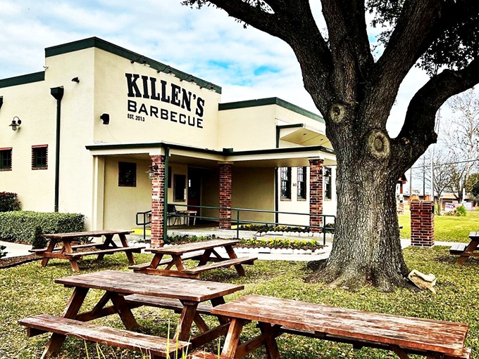 The unassuming exterior of Killen's BBQ stands like a temple to Texas smoking traditions, promising transcendent meat experiences within its humble walls. 