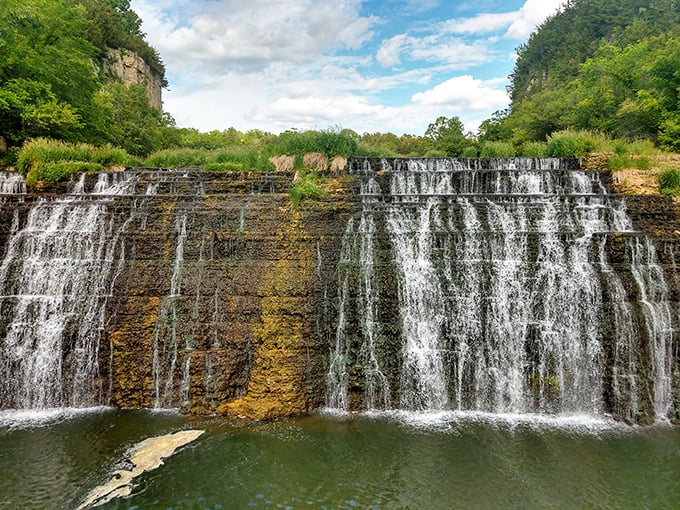 Nature's perfect staircase – Thunder Bay Falls cascades down limestone shelves, creating a mesmerizing display that hypnotizes visitors and silences even the chattiest companions.