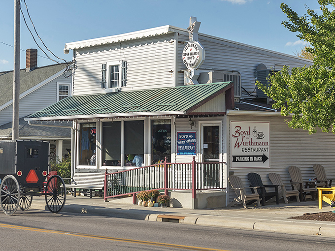 The classic white clapboard exterior with green trim isn't putting on airs—it's the genuine article, complete with Amish buggies parked outside.