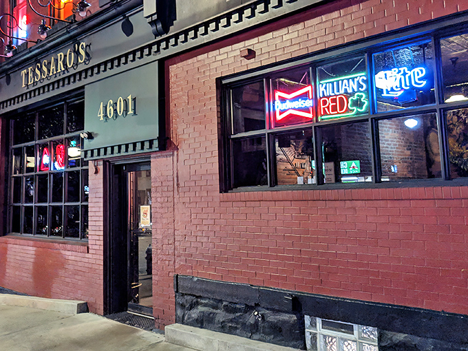 The brick facade and neon beer signs of Tessaro's aren't trying to impress you—they're too busy guarding Pittsburgh's best-kept burger secret.