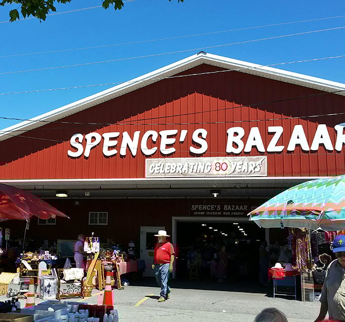 The iconic red barn of Spence's Bazaar stands like a treasure chest waiting to be opened, promising discoveries that'll make your weekend complete.