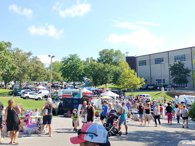 The weekend pilgrimage begins! Shoppers navigate this asphalt treasure map where one person's castoffs become another's must-haves. 