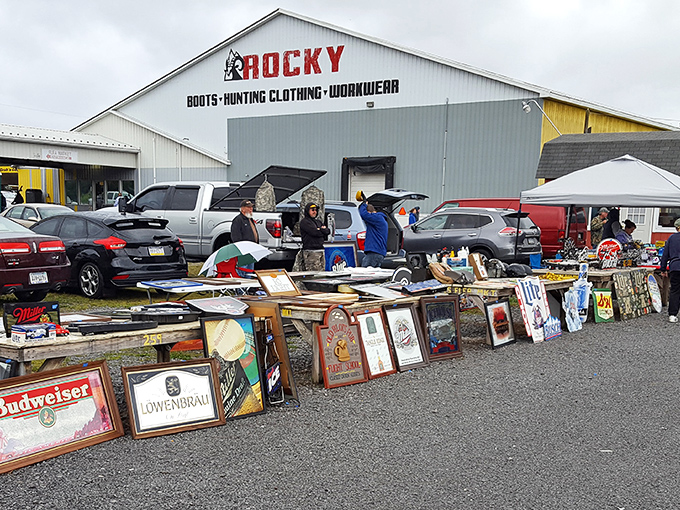 Treasure hunters scan tables under the summer sun, where one person's castoffs become another's prized discoveries at Leighty's bustling marketplace.